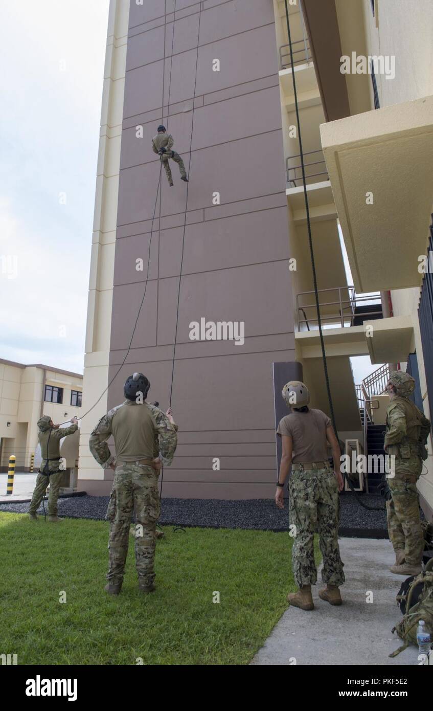 Sailors attached to Explosive Ordnance Disposal Mobile Unit (EODMU) 5 ...