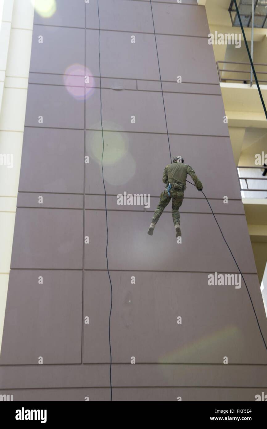 An Australian Army soldier repels from a tower during the unit level ...