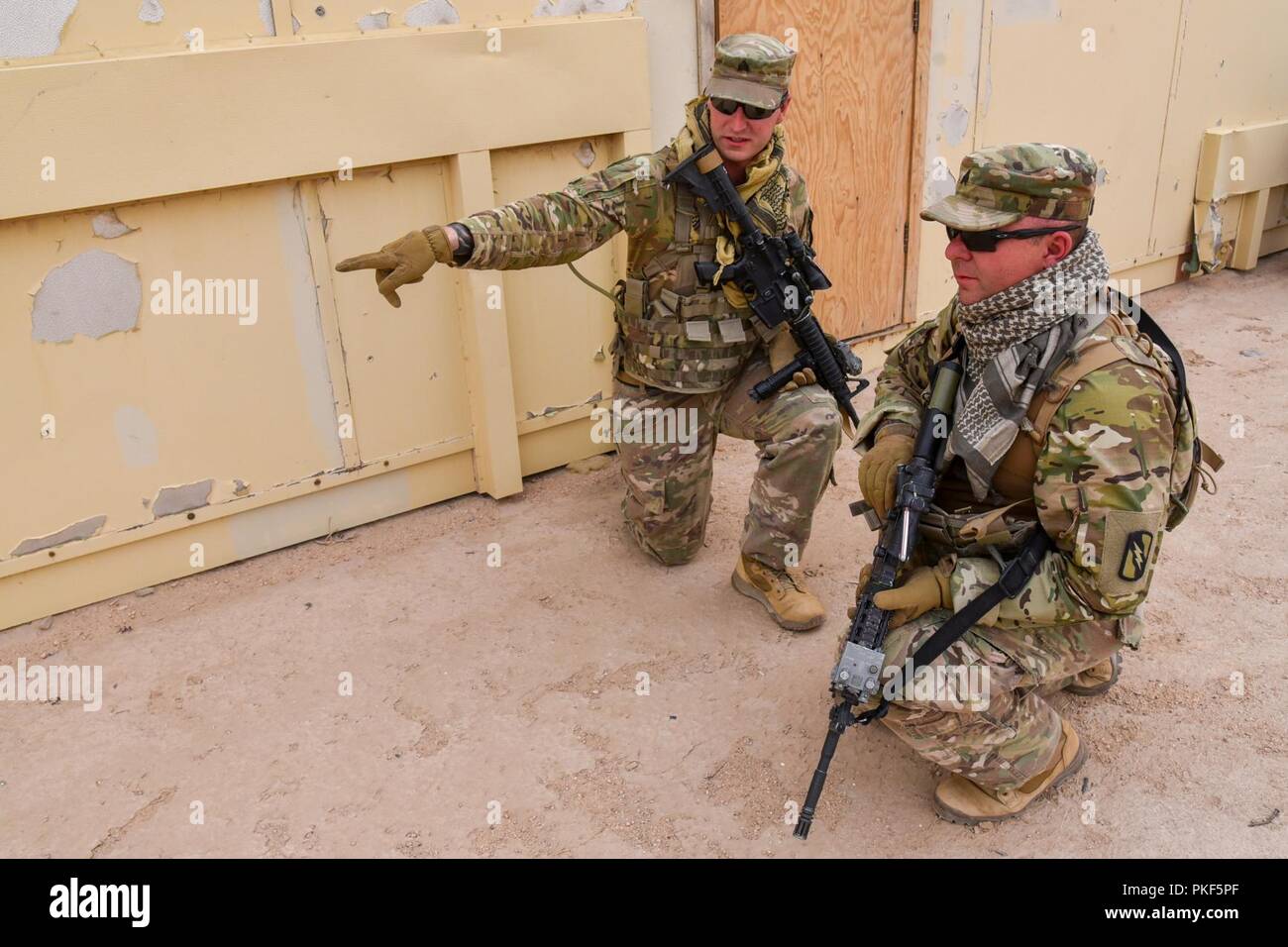 From left, U.S. Army Sgt. Donald Montgomery and Sgt. David Curry, both ...