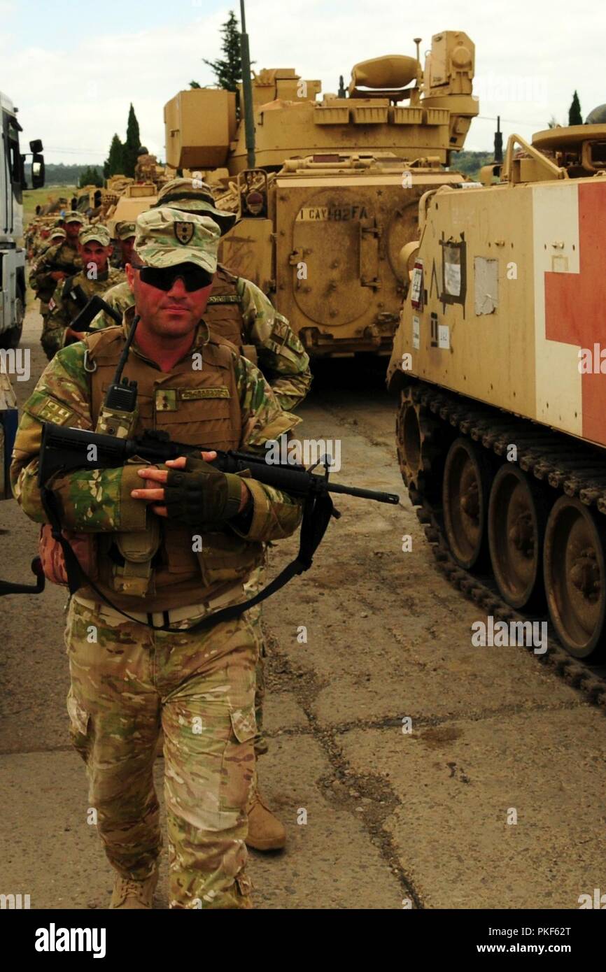 Georgian soldiers road march past several 2nd Battalion, 5th Cavalry ...