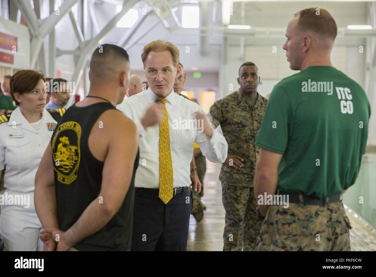 Under Secretary of the Navy Thomas B. Modly speaks with Marines from ...