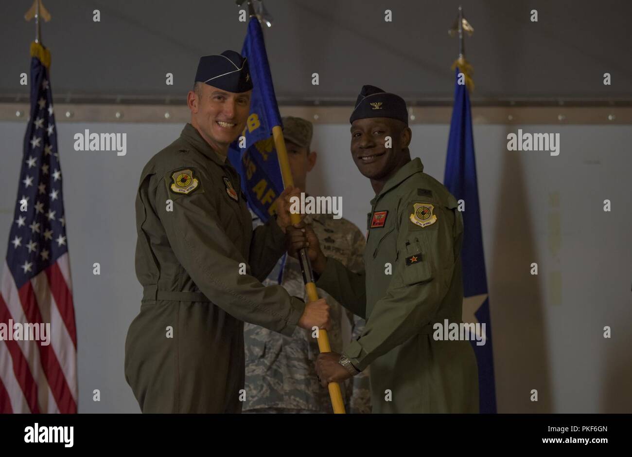 Brig. Gen. Robert Novotny, 57th Wing commander, passes the guidon to ...