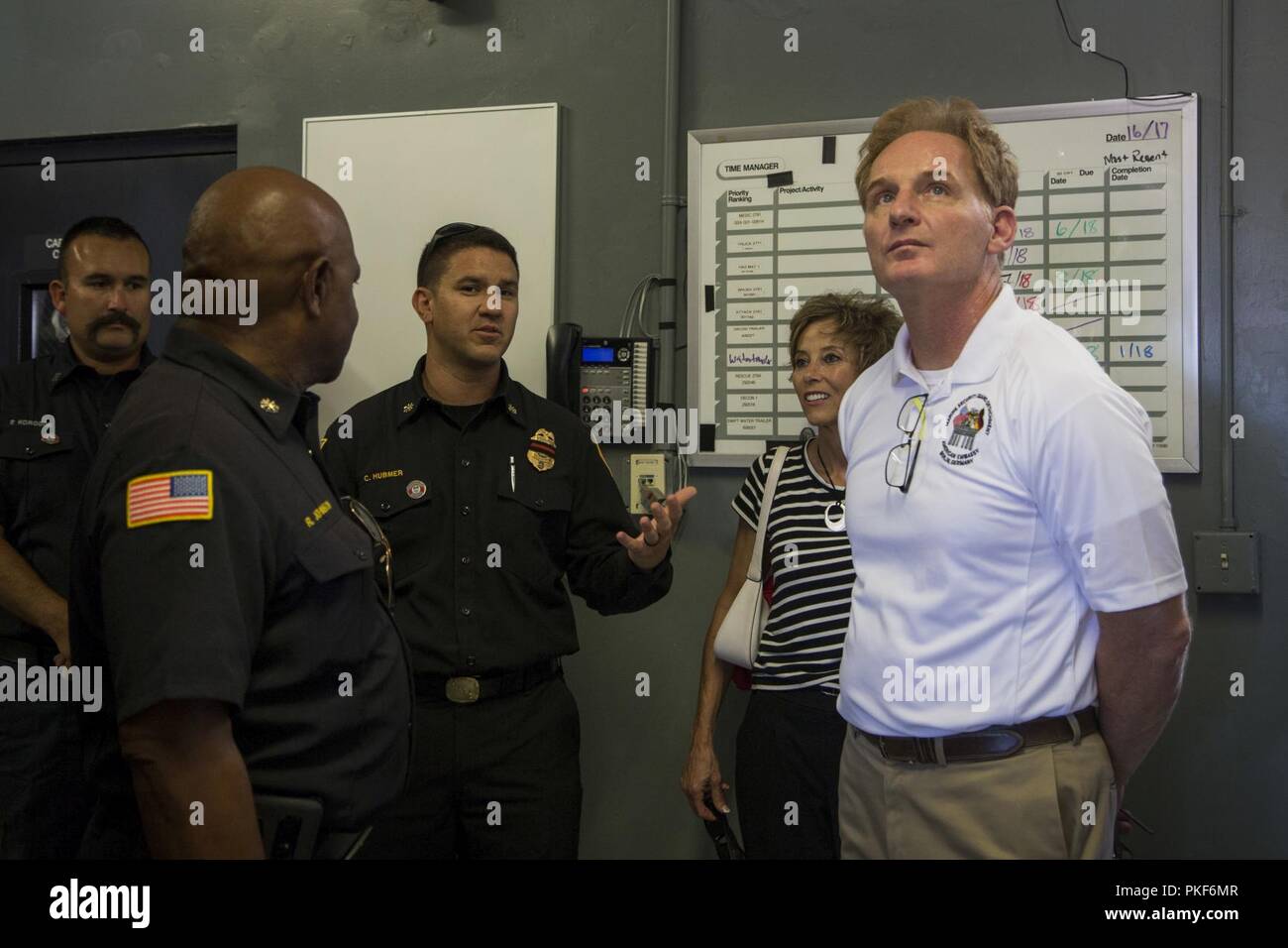 Chris Hubmer, center, deputy chief of operations, operations division ...