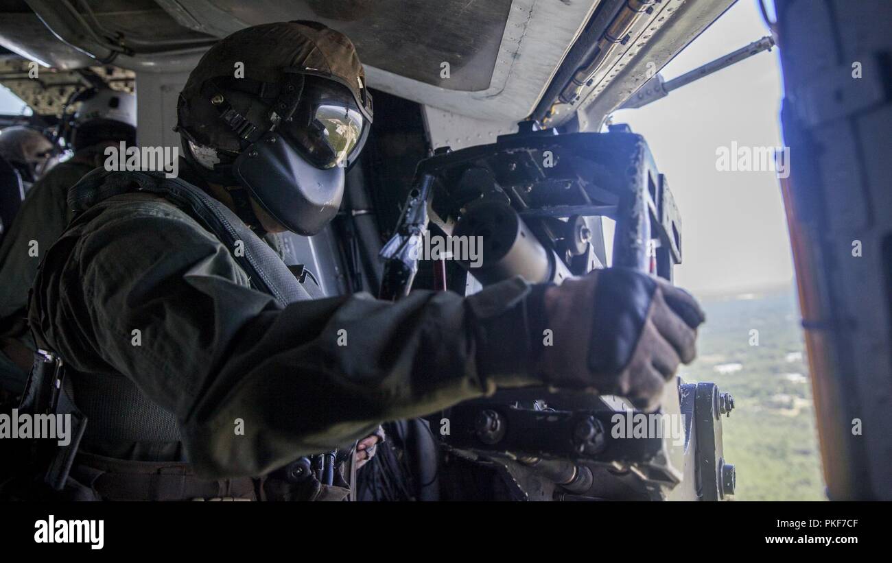 U.S. Marine Cpl. Oscar Solis, a crew chief with Marine Heavy Helicopter ...