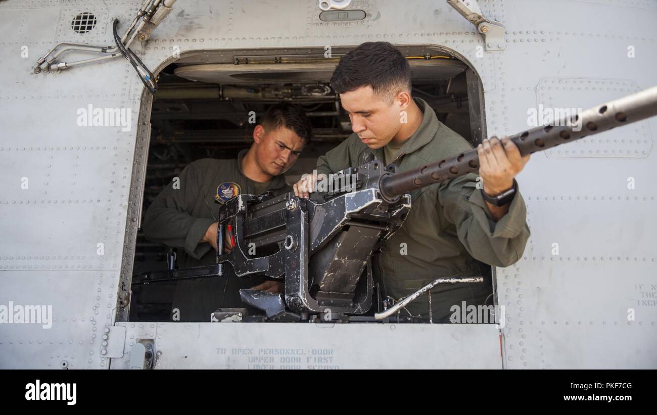 U.S. Marine Lance Cpl. Kaleb O. Clark (left) and Cpl. Oscar Solis ...