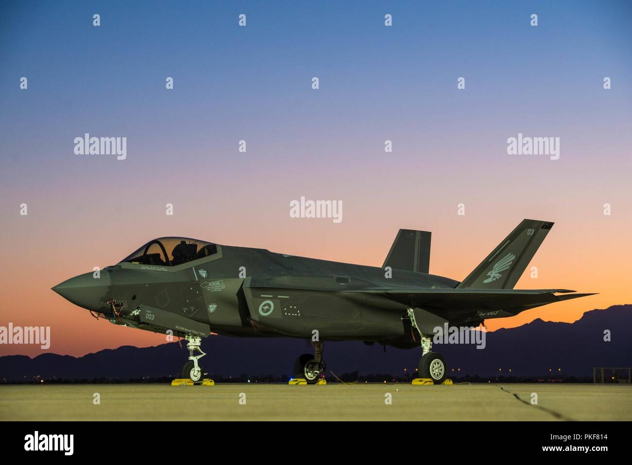 The sun sets behind a Royal Australian Air Force F-35A Lightning II at ...