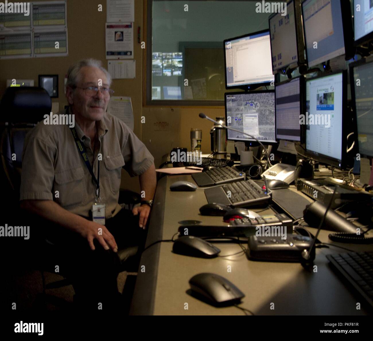 Lawrence Modjeska, a public safety dispatcher monitors a locator map to ...