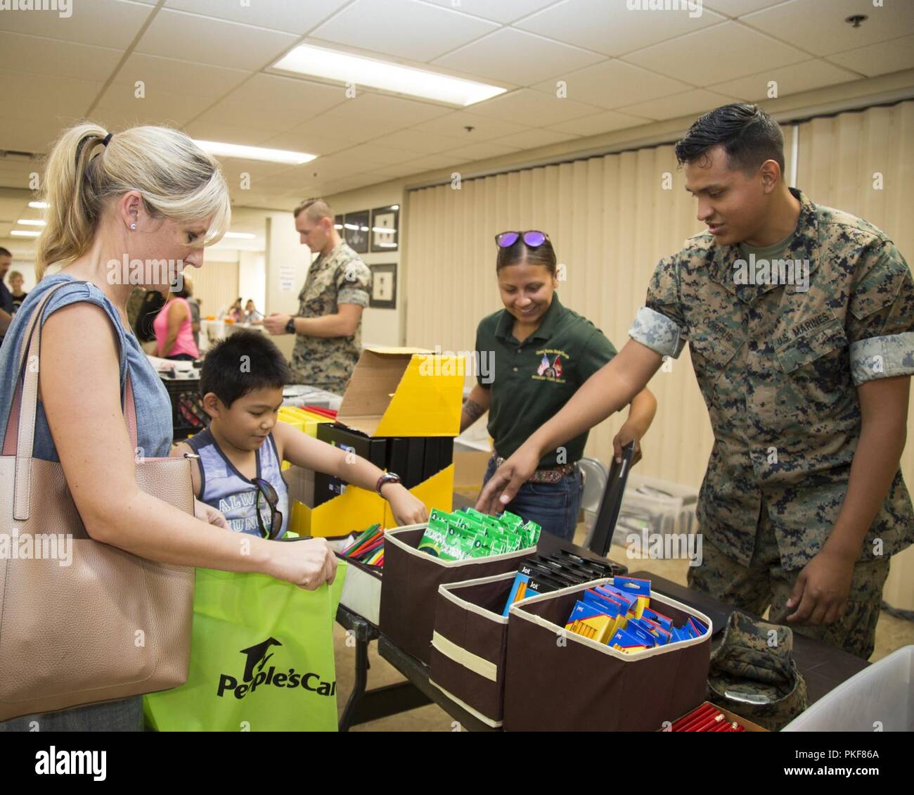 Marines volunteer to hand out donated school supplies to military ...