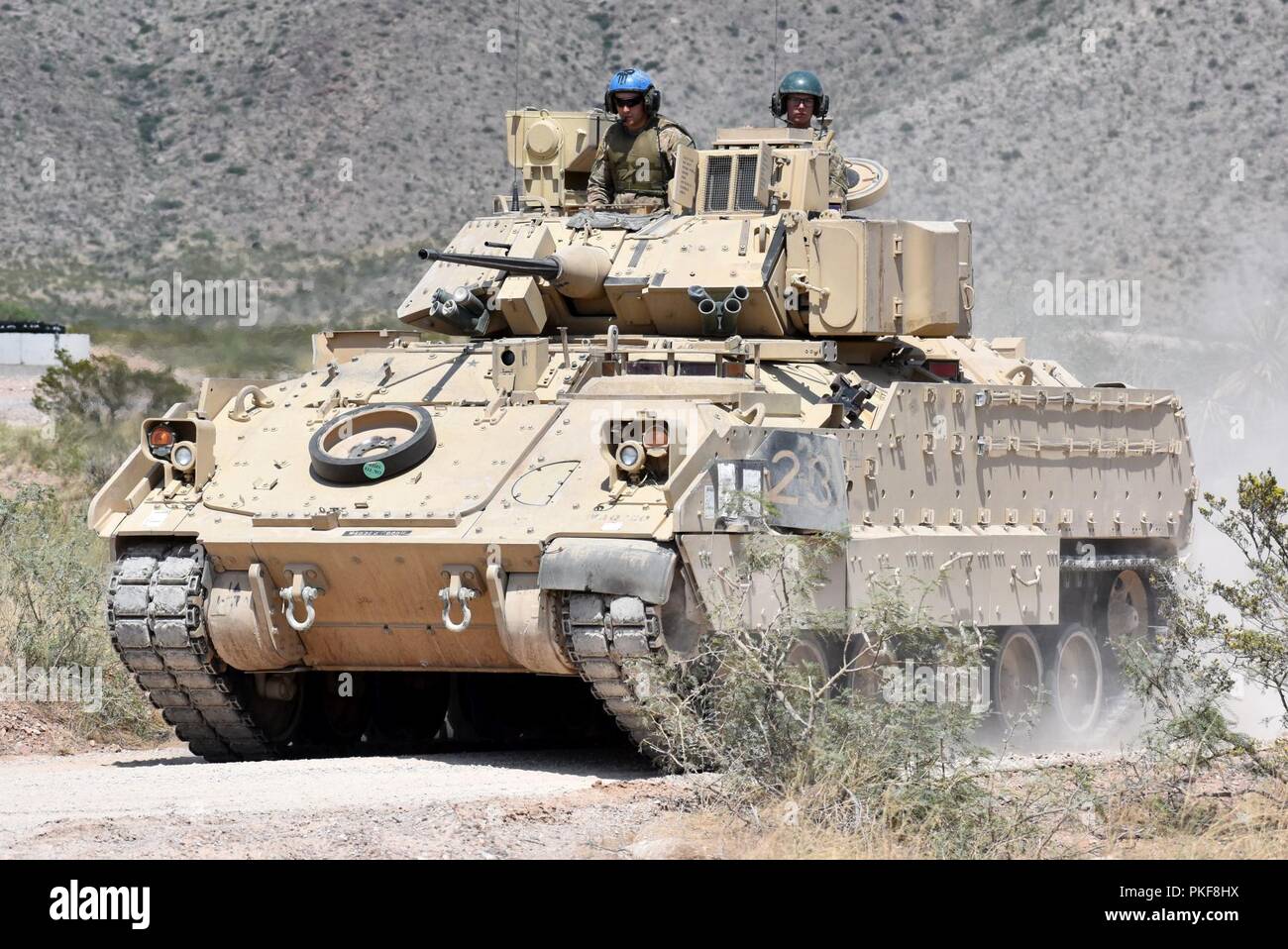 An M2A3 Bradley Fighting Vehicle crew heads to the range during gunnery ...