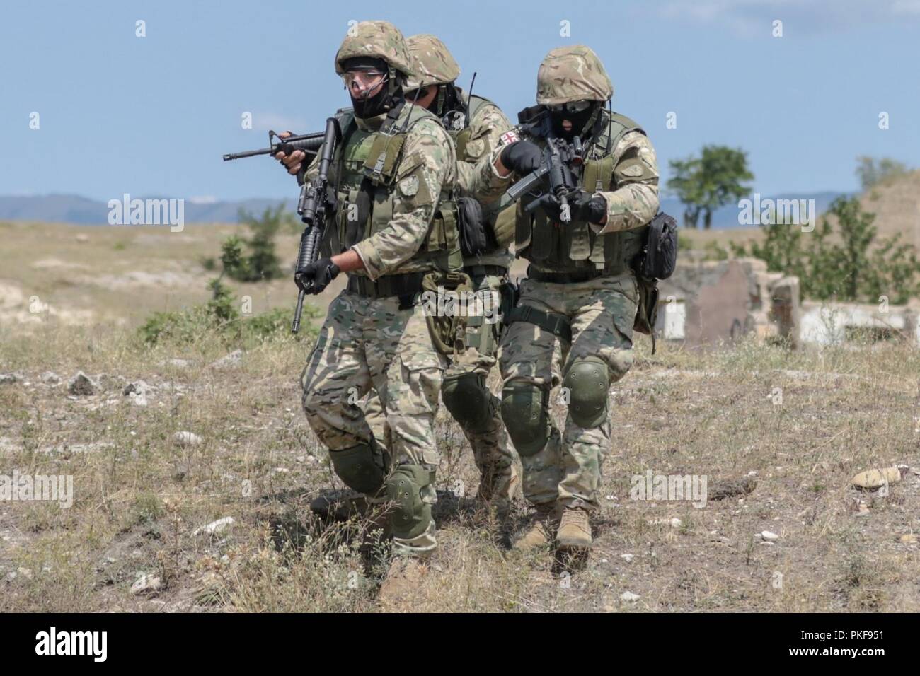 A Georgia Armed Forces (GAF) fire team moves towards their objective ...