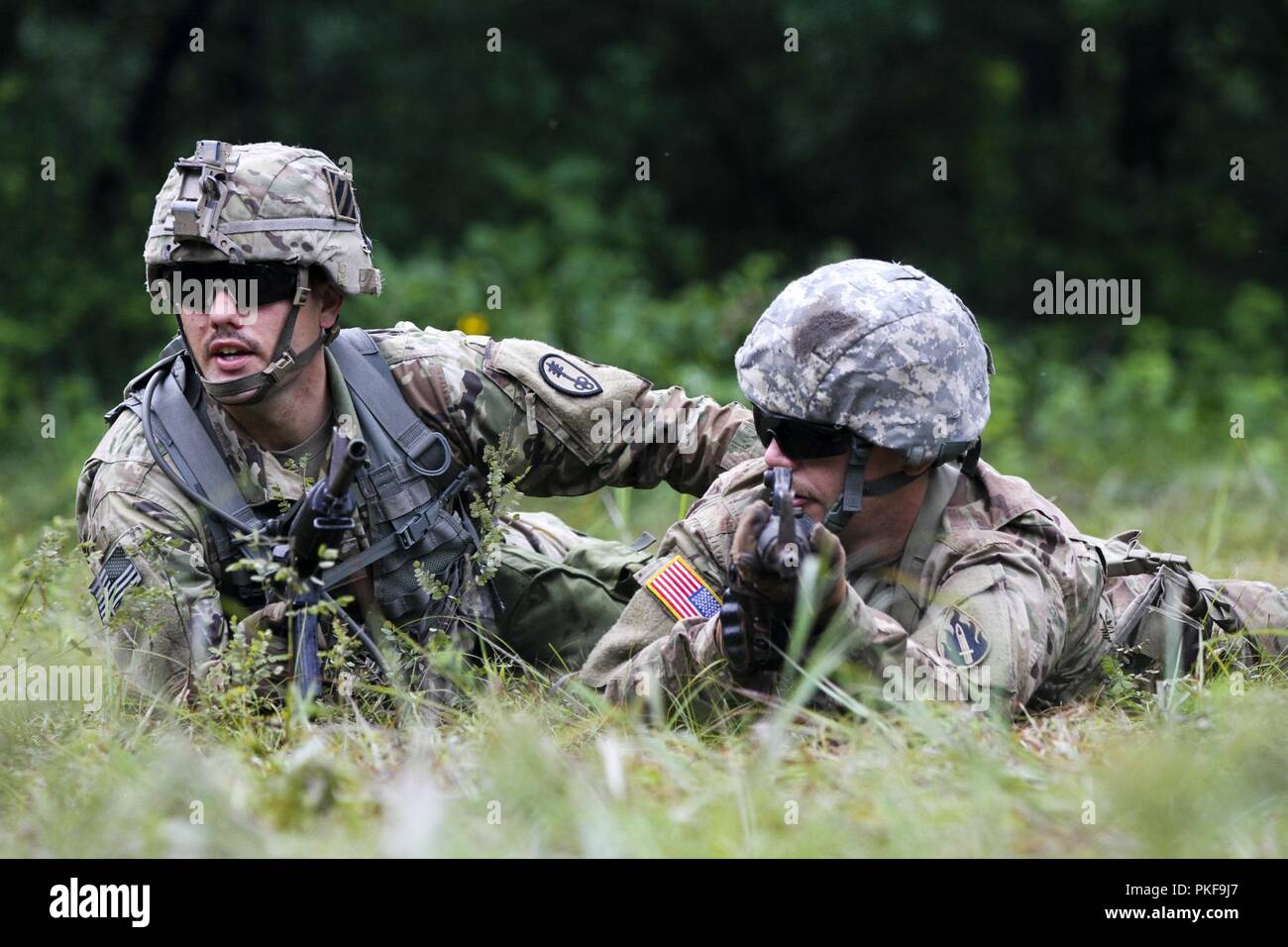U.S. Army Reserve Sgt. Zachary Grabau, left, of the 384th Military ...