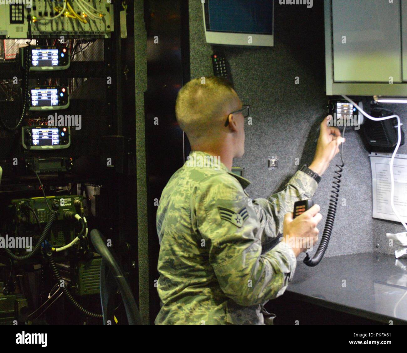 Senior Airman Mitchell Vavra demonstrates the use of equipment inside ...