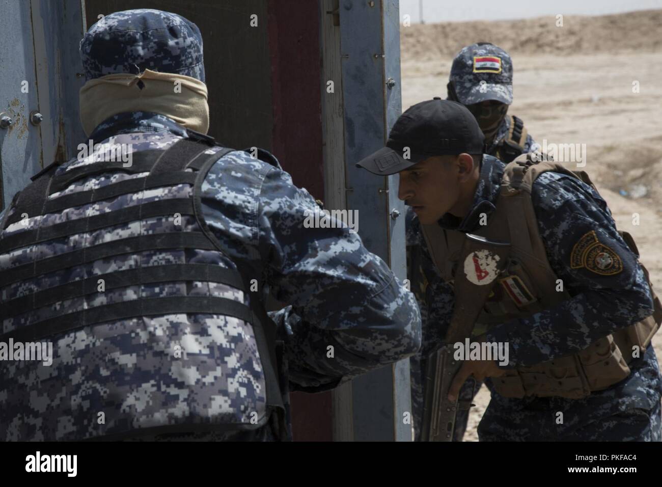 Members of the Iraq Federal Police assigned to the 13th Brigade ...