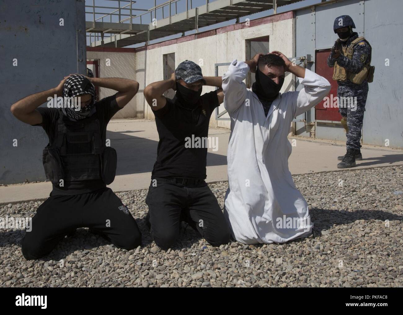 A member of the Iraq Federal Police with the 13th Brigade, practices ...