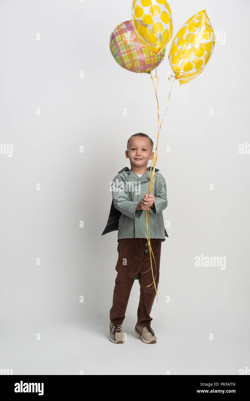 happy little boy with balloon on white background, studio shot Stock ...