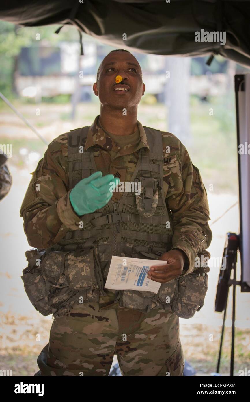 U.S. Army Sgt. Eric Jones, 901st Medical Detachment, demonstrates on ...
