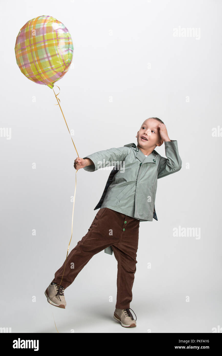 happy little boy with balloon on white background, studio shot Stock ...