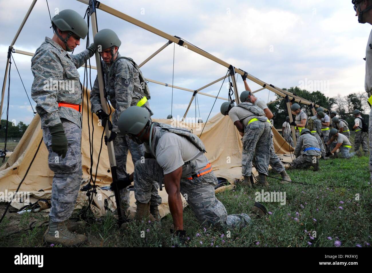 Members of the 927th ASTS work together to build tents at Fort McCoy ...