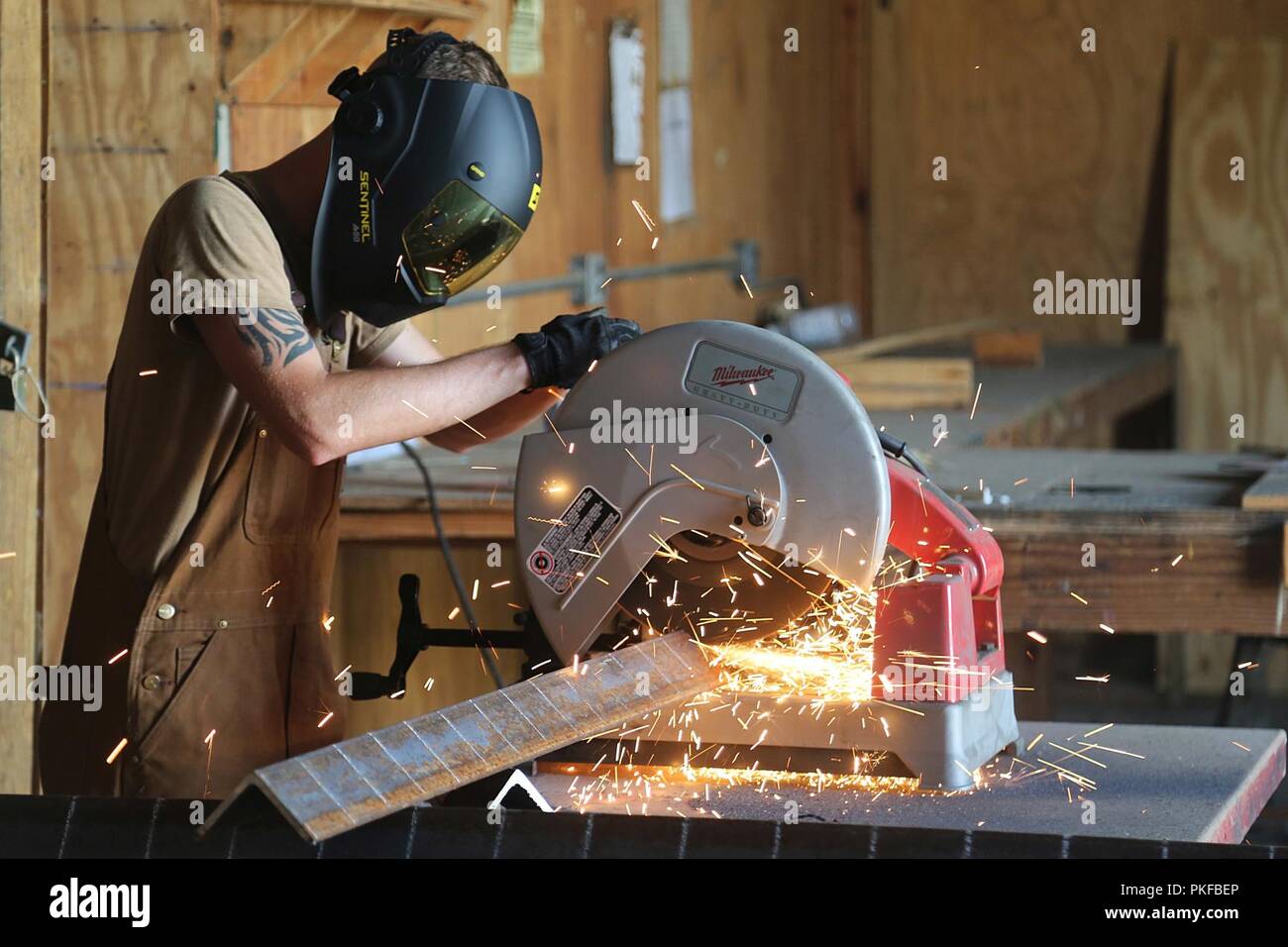 U.S. Navy Steelworker 3rd Class Jonathan Rowe, assigned to Naval Mobile ...