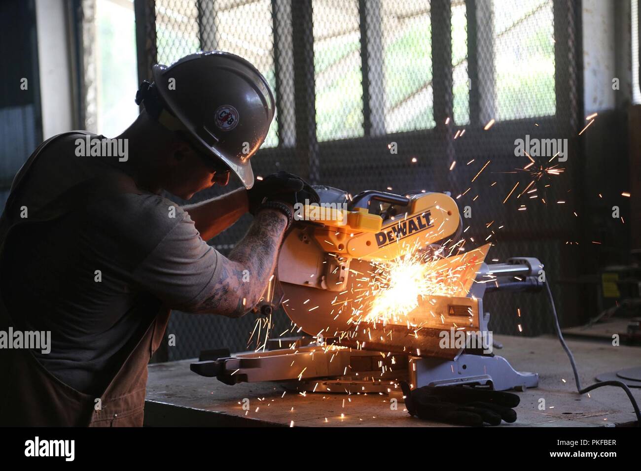 U.S. Navy Construction Mechanic 1st Class Aaron Wymore, assigned to ...
