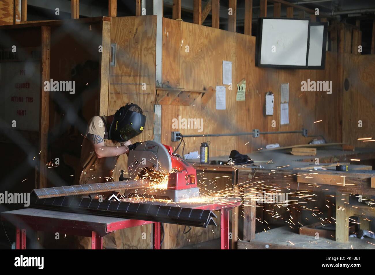 U.S. Navy Steelworker 3rd Class Jonathan Rowe, assigned to Naval Mobile ...