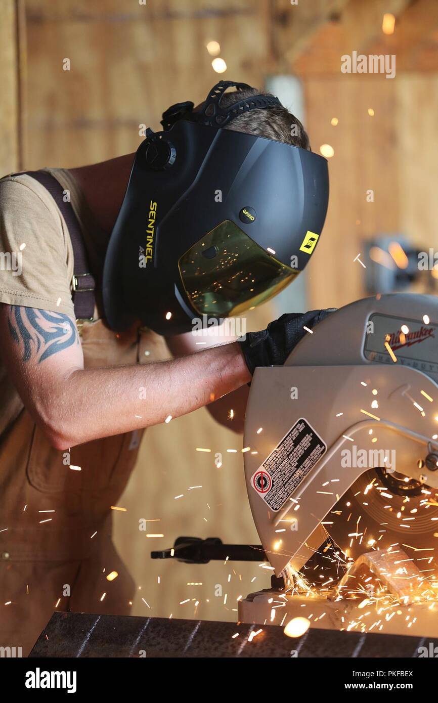 U.S. Navy Steelworker 3rd Class Jonathan Rowe, assigned to Naval Mobile ...