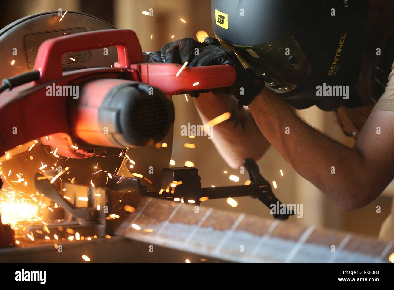 U.S. Navy Steelworker 3rd Class Jonathan Rowe, assigned to Naval Mobile ...