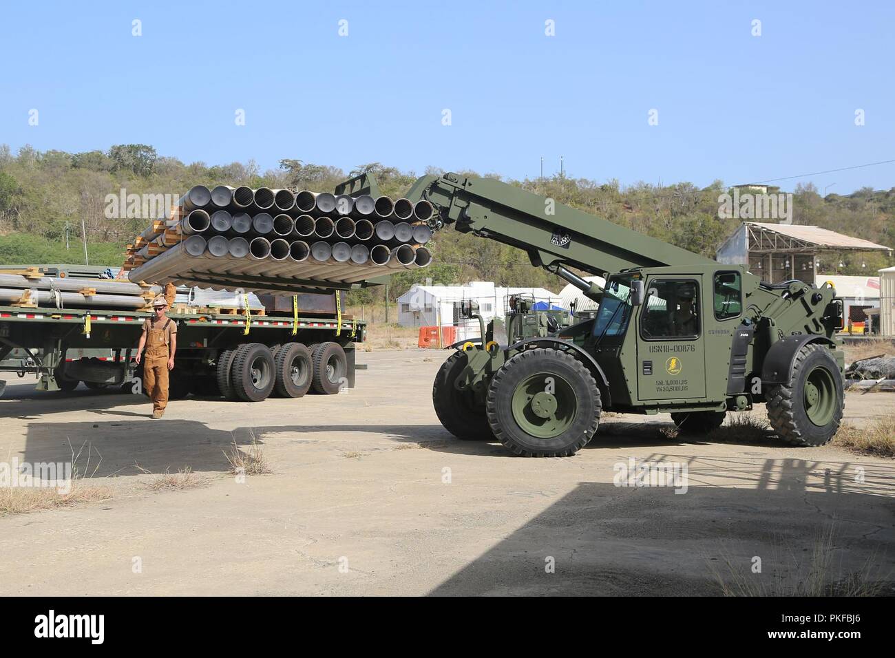 U.S. Navy Seabees assigned to Naval Mobile Construction Battalion (NMCB ...