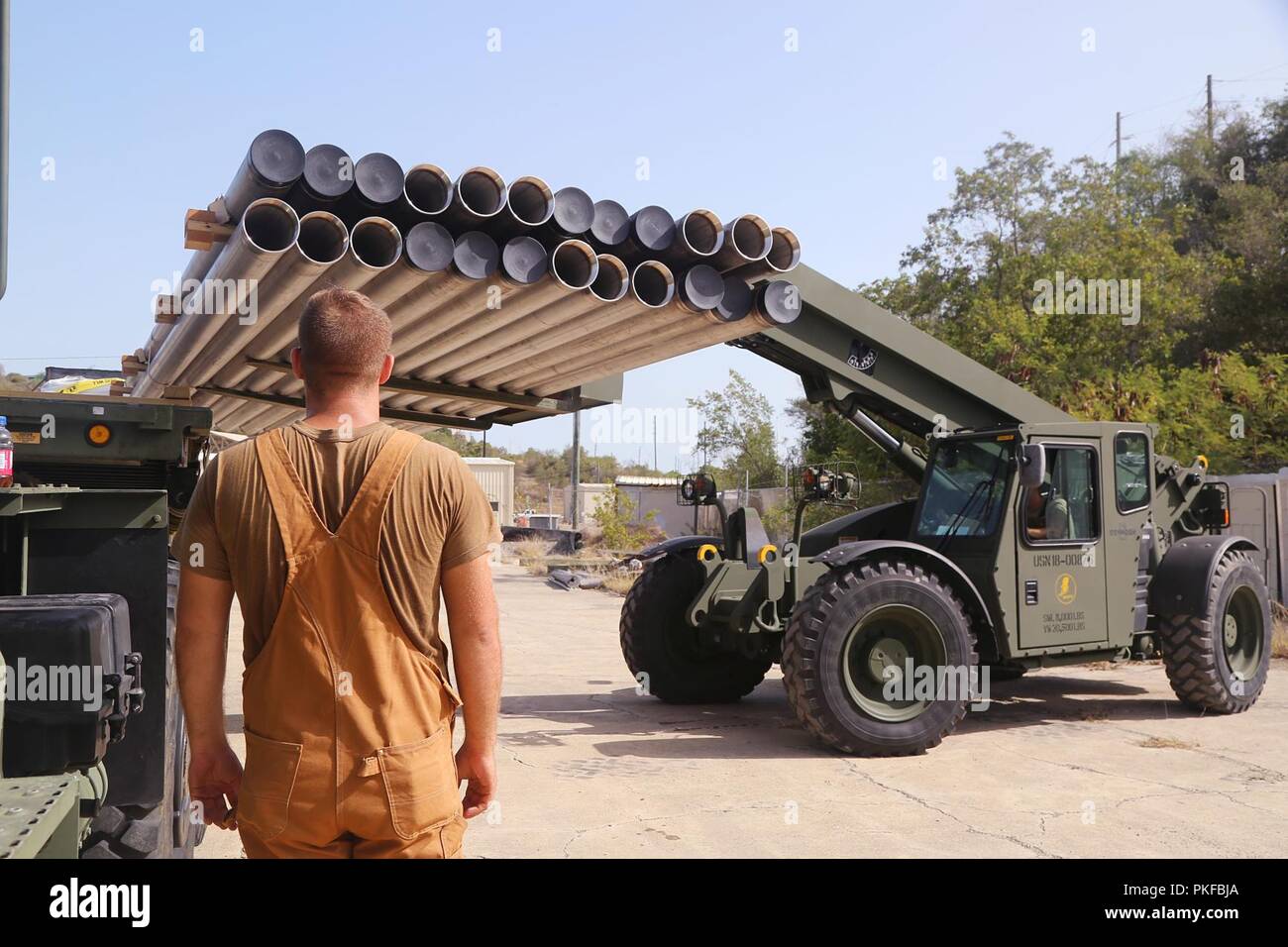U.S. Navy Equipment Operator 2nd Class Sawyer Buck, assigned to Naval ...