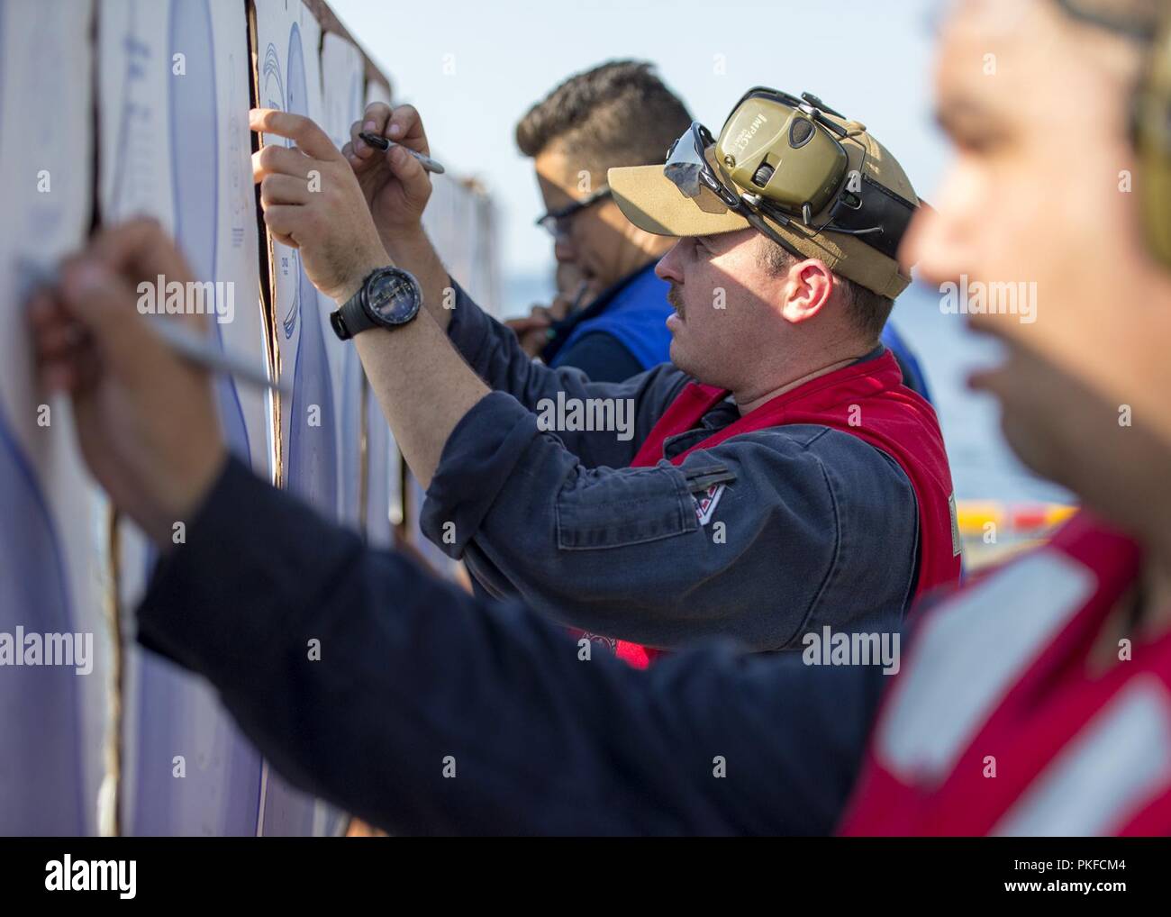 OCEAN (Aug. 10, 2018) Gunner’s mates score small arms target charts ...