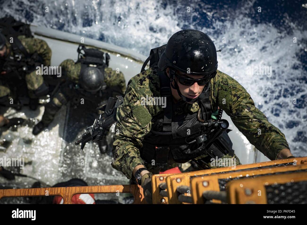 SEA (Aug. 7, 2018) Ensign Chris Mead, assigned to the Arleigh Burke ...