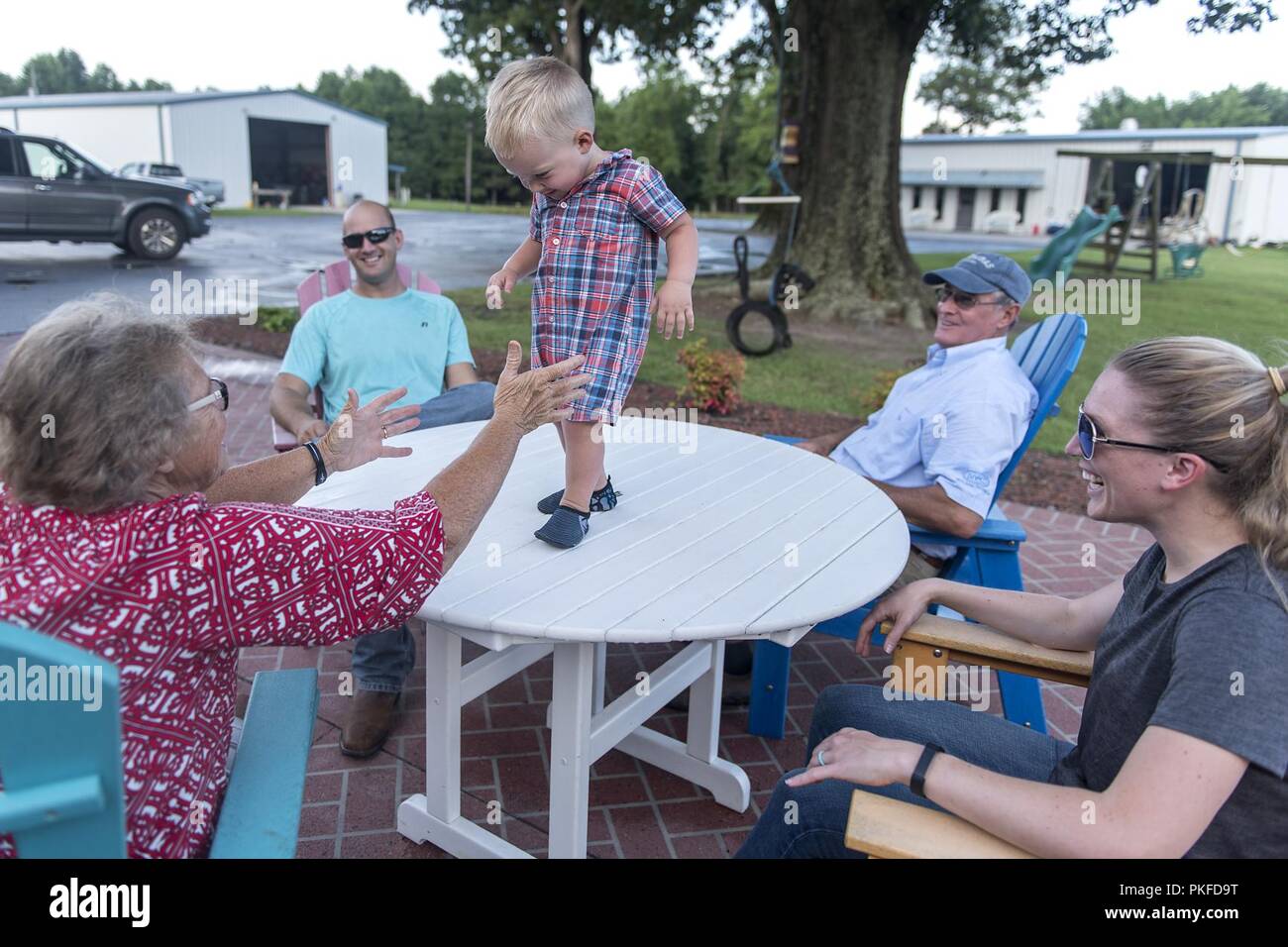 Calvin Holmquist, 20 months old, walks across the table to Sue Barrow ...