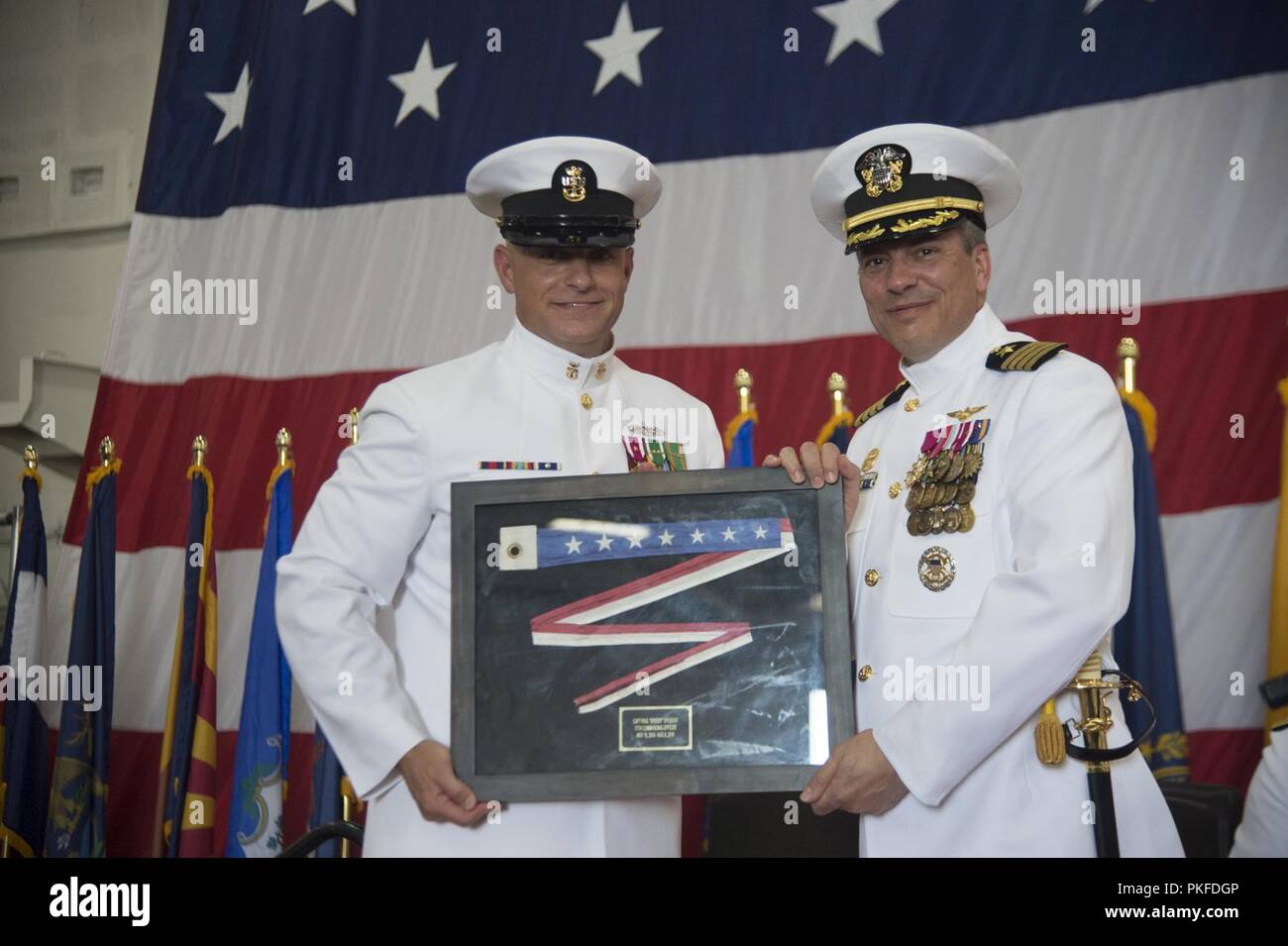 Va. (Aug. 9, 2018) Command Master Chief Todd A. Mangin presents Capt ...