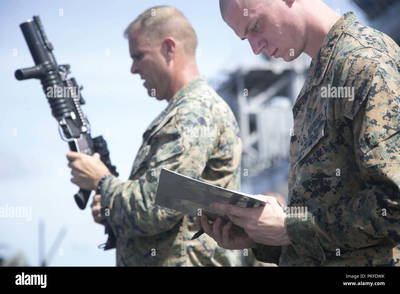 PACIFIC OCEAN - U.S. Marine Lt. Col. Matthew Danner (left), commanding ...