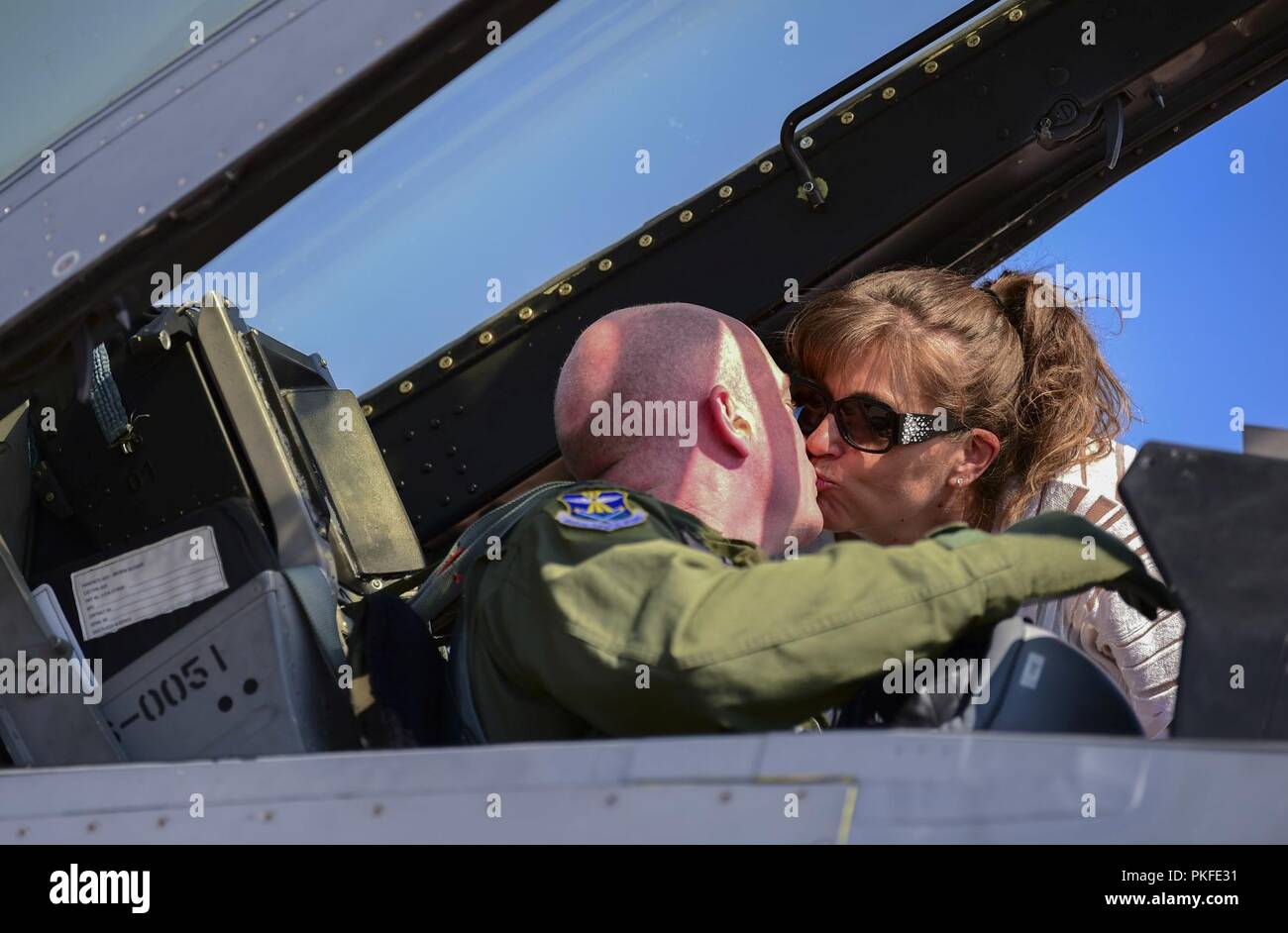 Col. Troy Endicott, 460th Space Wing commander, kisses his wife Tammy ...