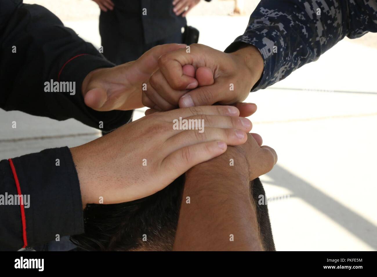 An Italian Carabinieri instructor shows an Iraqi Federal Police member ...