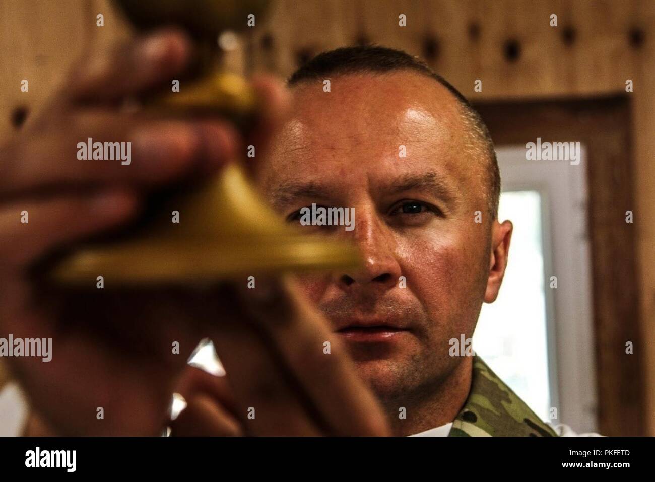 Chaplain (Cpt.) Marcin Bulinski, assigned to the 101st Special Troops ...