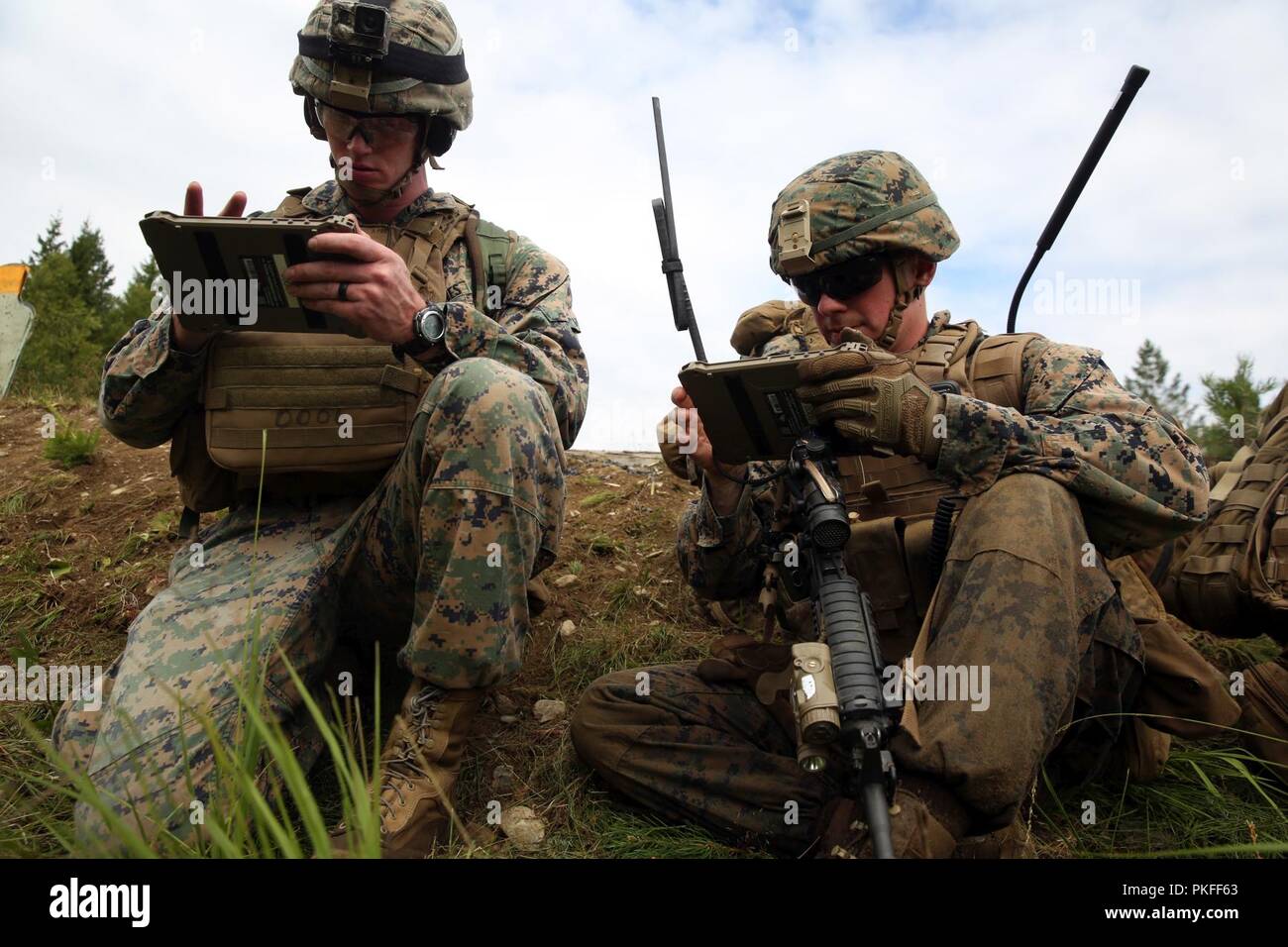 U.S. Marines with Marine Rotational Force-Europe 18.1 relay information ...
