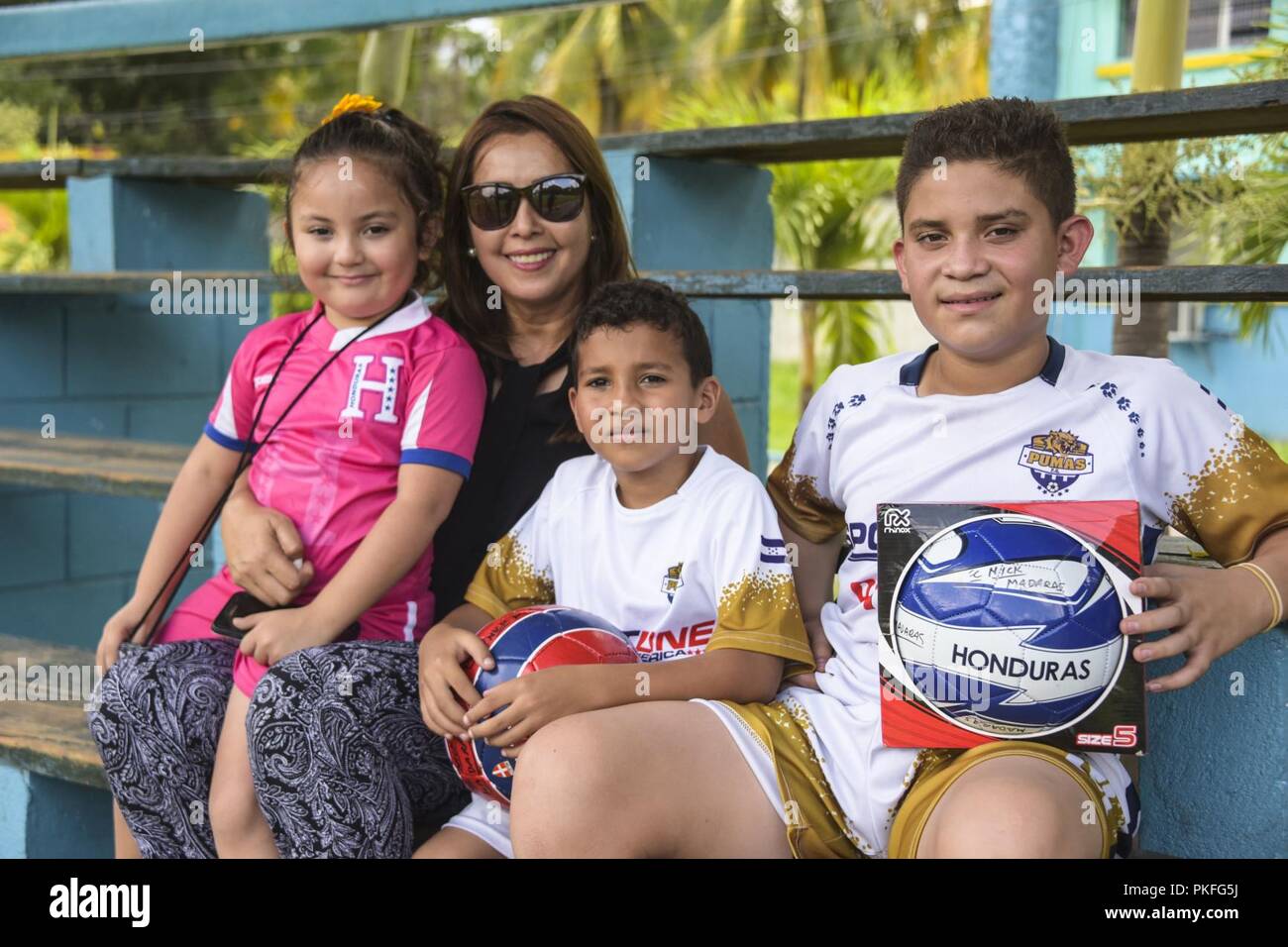 Kenneth Fernandez (right), a Kick for Nick recipient, poses with his ...