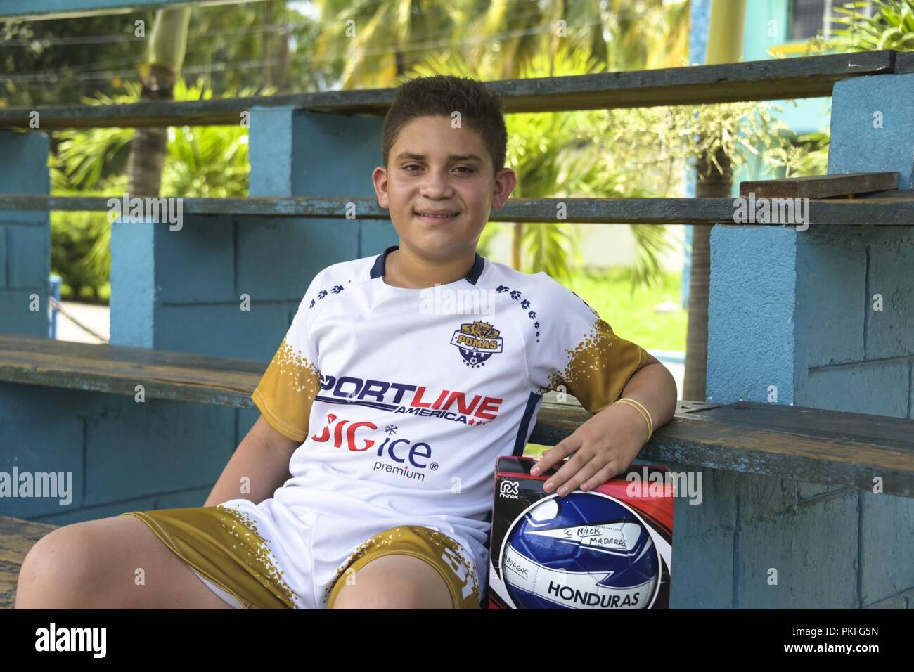 Kenneth Fernandez, a Kick for Nick recipient poses with a soccer ball ...