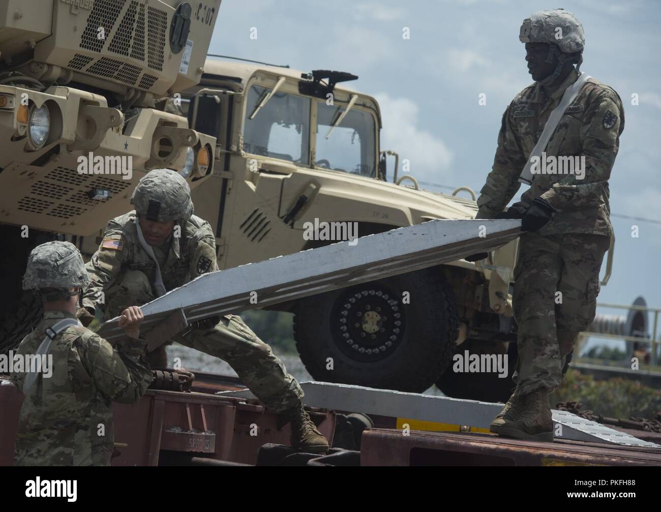 U.S. Army Soldiers prepare to transport vehicles during rail operations ...