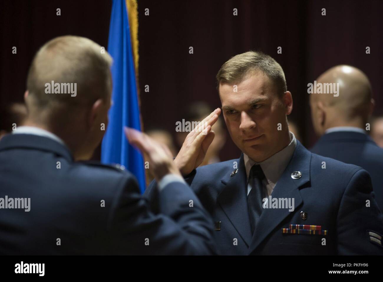 A Base Honor Guard graduate salutes Col. Derek Salmi, 92nd Air ...