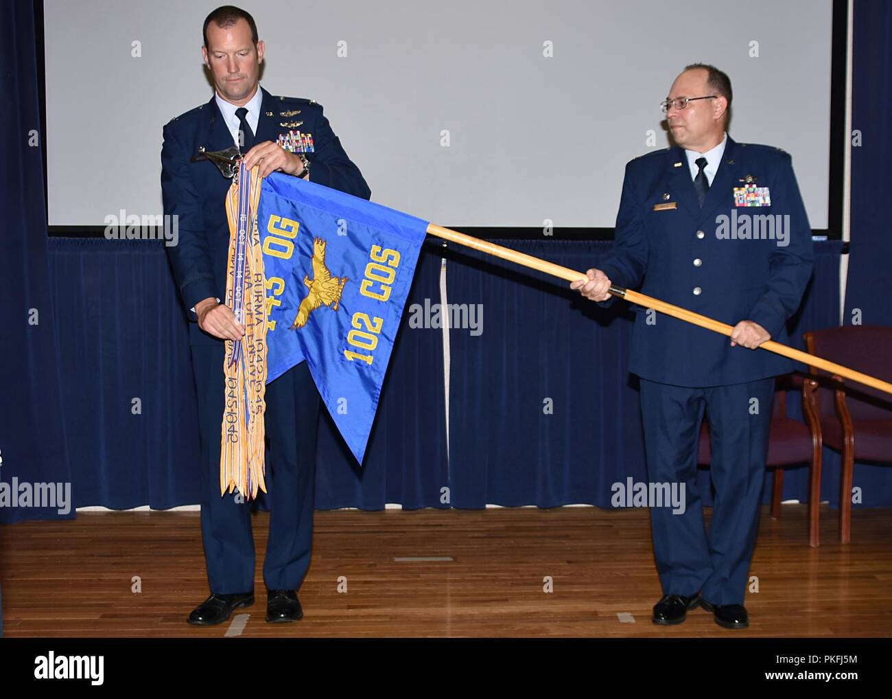 Col. Adam G. Wiggins, left, the commander of the 143d Operations Group ...