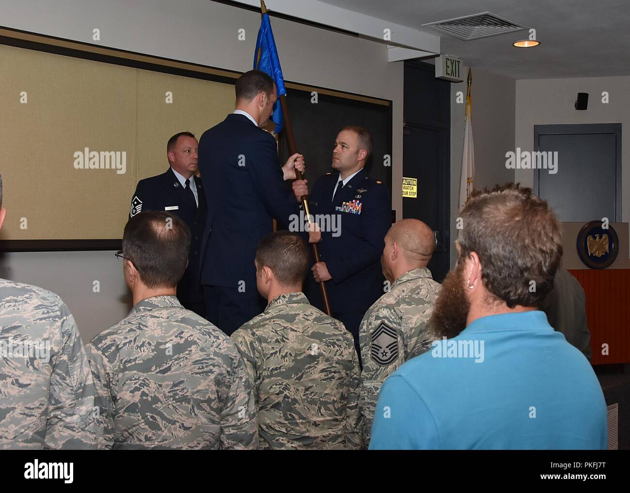 Col. Adam G. Wiggins, the 143d Operations Group commander, passes the ...