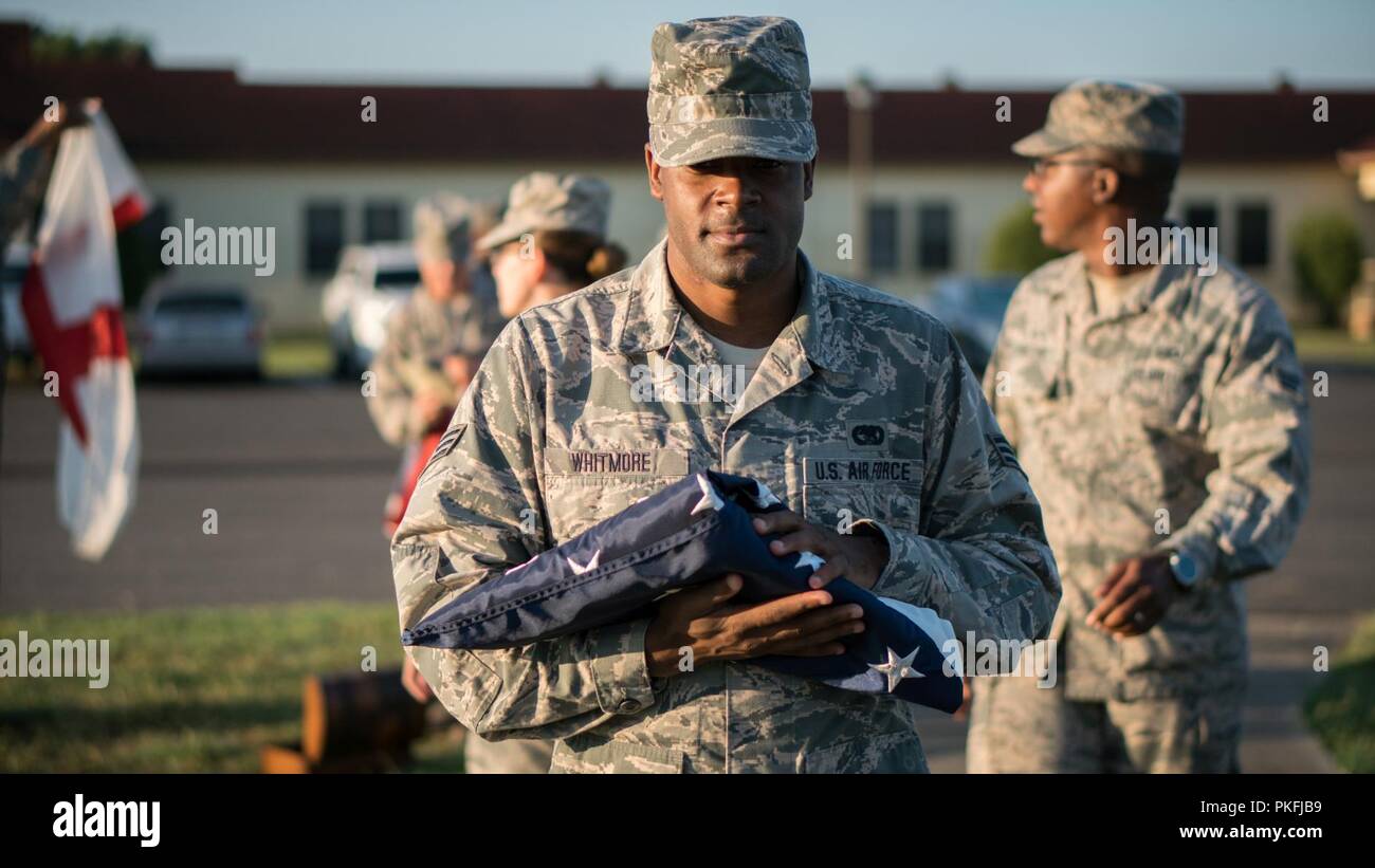 Senior Airman Ray Whitmore, Airman Leadership School student, carries ...