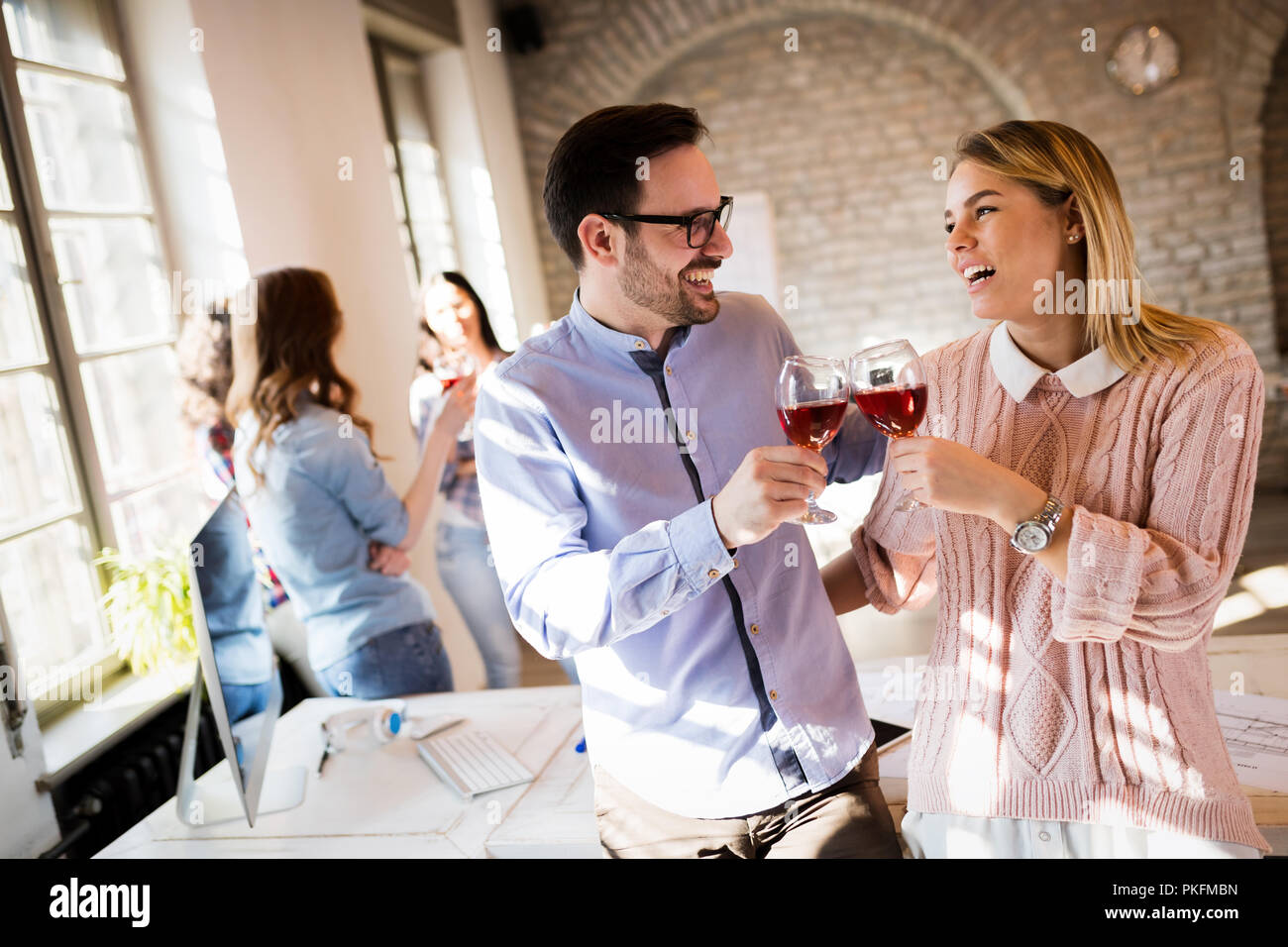 Group of successful architects celebrating in office Stock Photo - Alamy