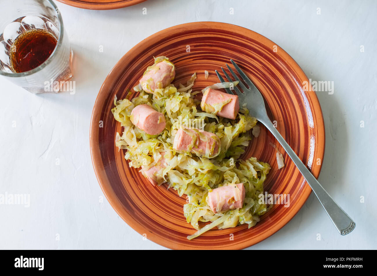 Traditional dish of german cuisine - Cabbage stew with grilled sausage ...
