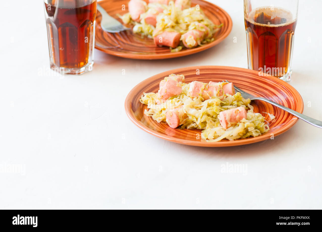 Traditional dish of german cuisine - Cabbage stew with grilled sausage ...