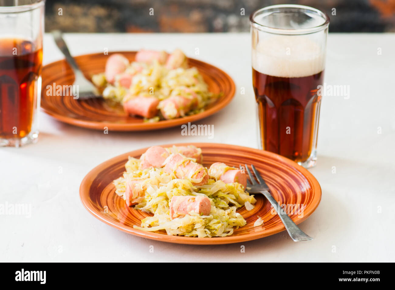 Traditional dish of german cuisine - Cabbage stew with grilled sausage ...