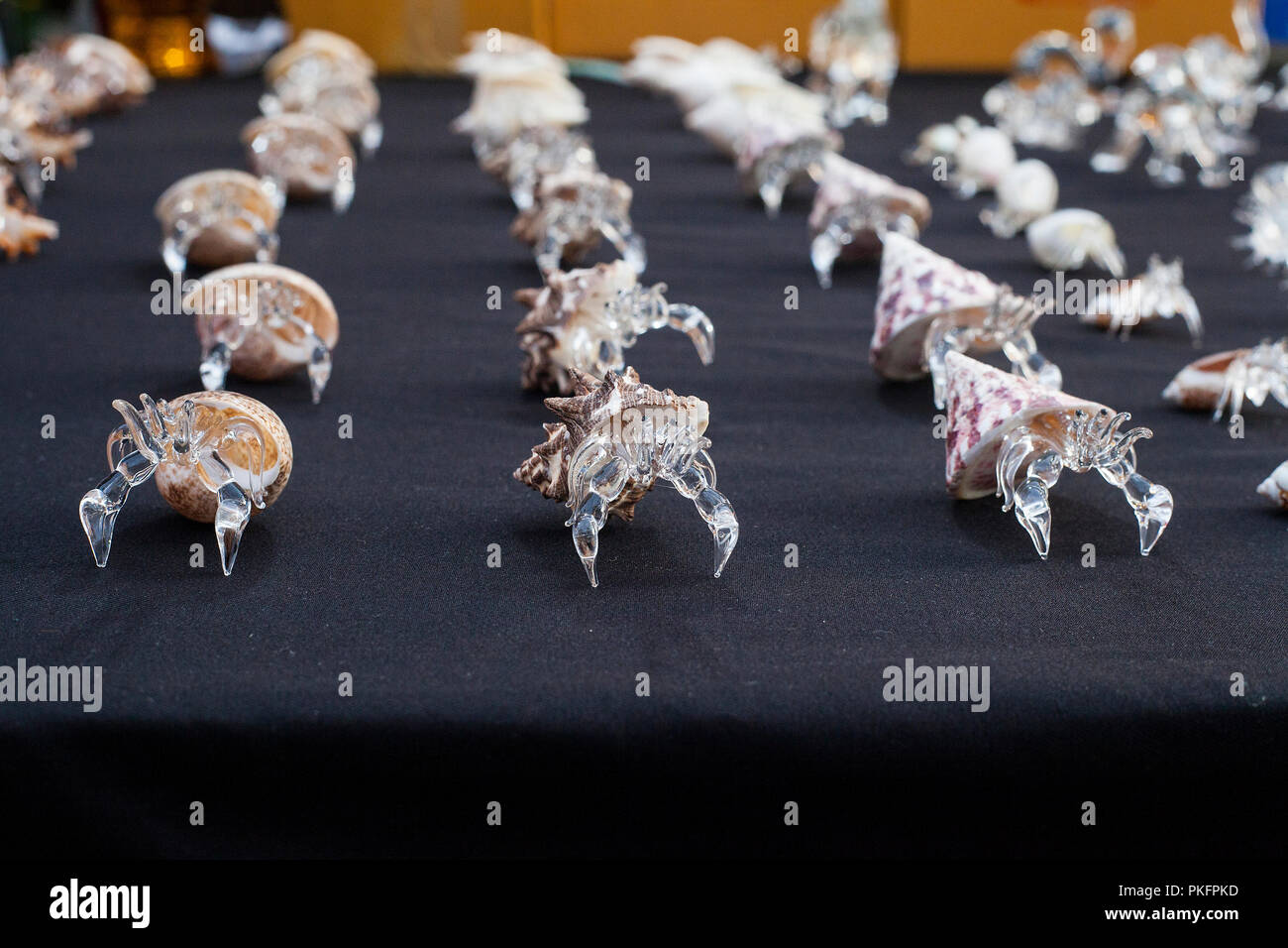 Glass crab in sea shell. Toys figurine animals display Stock Photo - Alamy